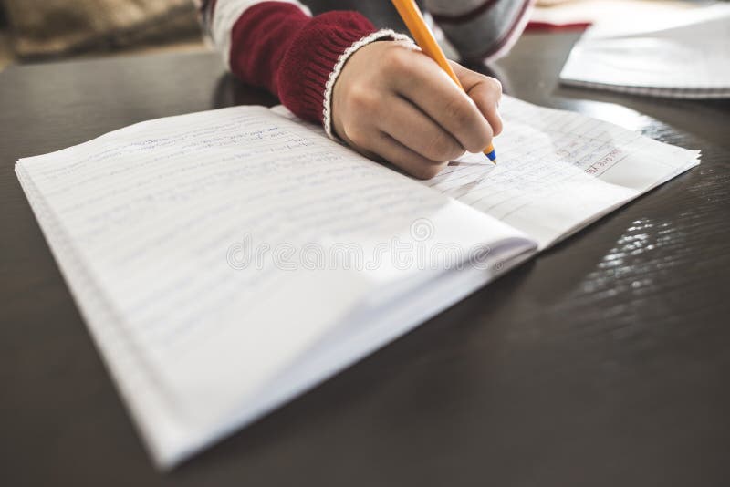 Child write in a notebook. stock photo. Image of study - 63378834