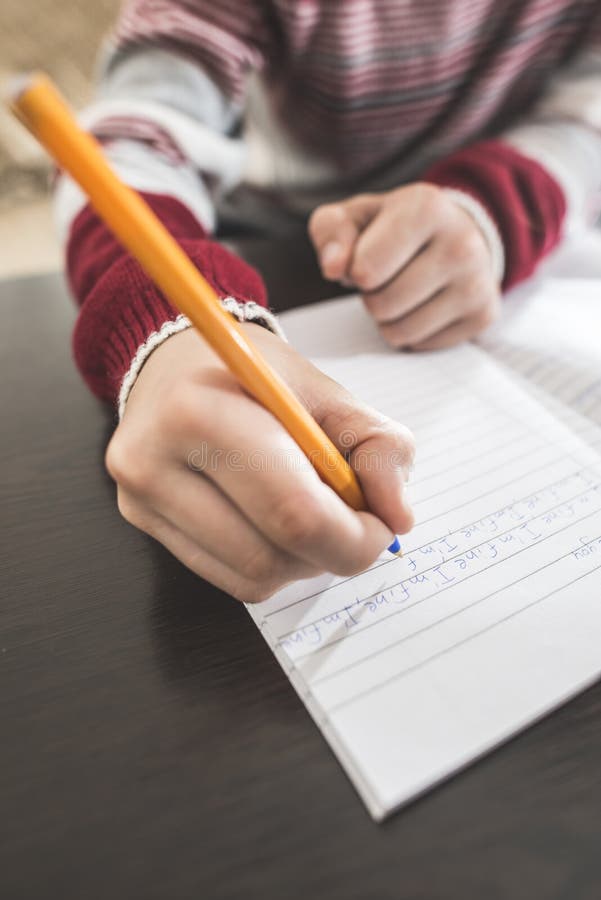 Child write in a notebook. stock image. Image of home - 63378881