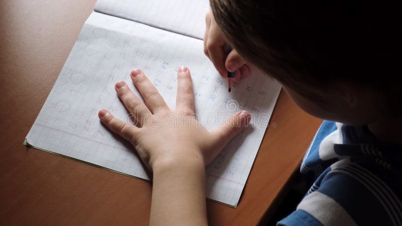 The Child Writes Down the Answer To the Solution of the Example in a ...