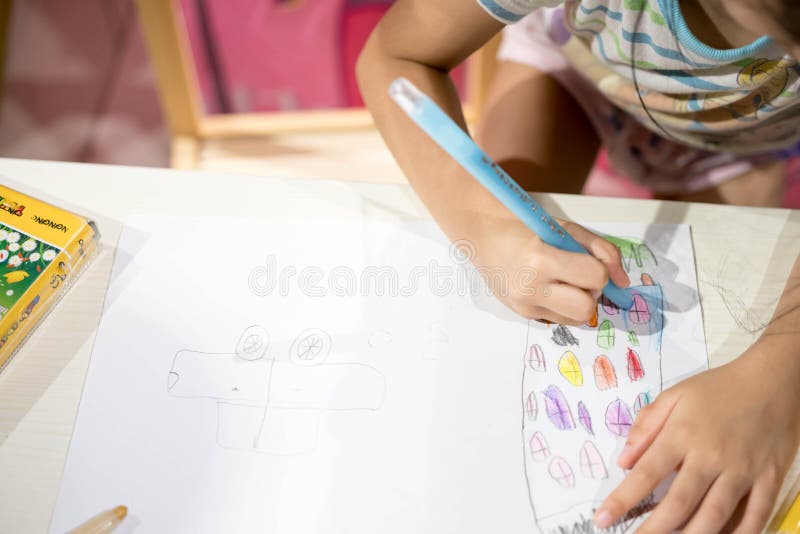 Child Writing Drawing Coloring on Paper Using Crayon Stock Photo ...