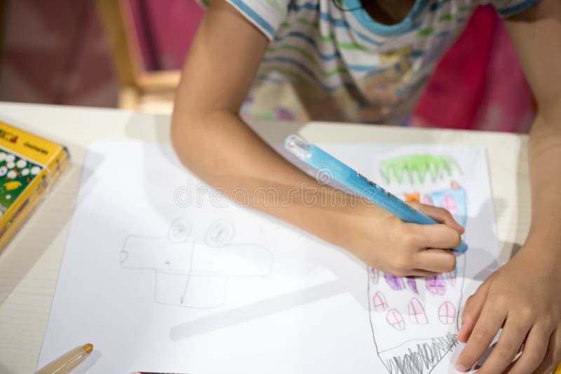 Child Writing Drawing Coloring on Paper Using Crayon Stock Photo ...