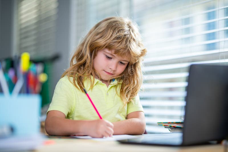Child Writing Homework in School Class. School Boy Making Notes in ...