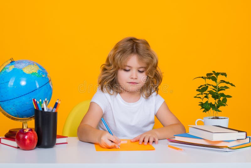 School Student Writing in Exercise Book, Studying in Classroom ...