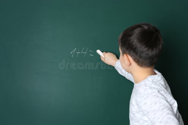 Child Writing Math Sum on Chalkboard. Stock Photo - Image of concept ...