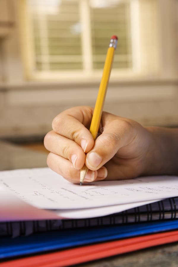Child Writing in Notebook stock image. Image of paper - 12543729