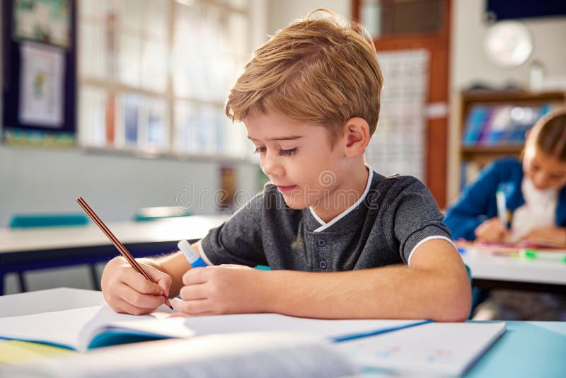 Child Writing in Notebook at Primary School Stock Photo - Image of ...