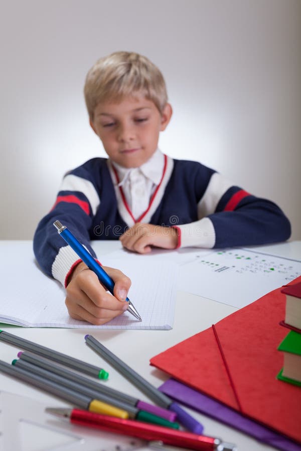 Child writing in notebook stock image. Image of room - 48365901