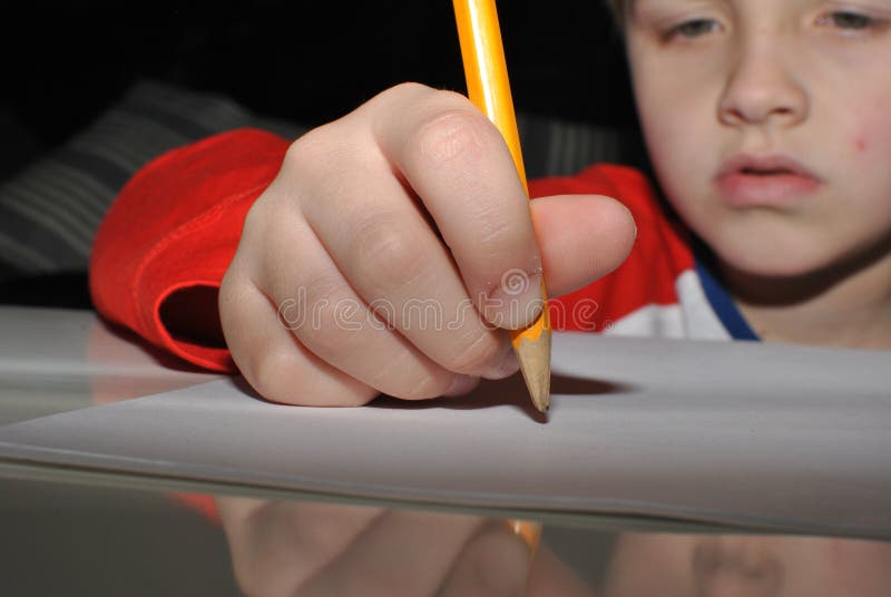 Child writing with pencil stock image. Image of school - 51976857