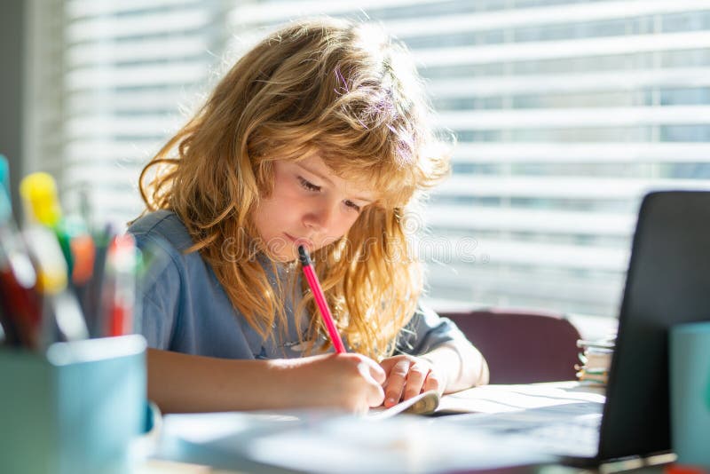 Child Writing at School. School Boy Making Notes in Copybook during ...