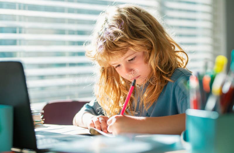 Child Writing at School. School Boy Making Notes in Copybook during ...
