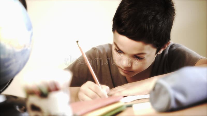 Child writing at school stock footage. Video of boys - 43179538