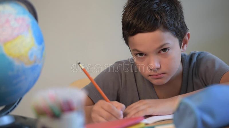 Child writing at school stock footage. Video of boys - 43179538
