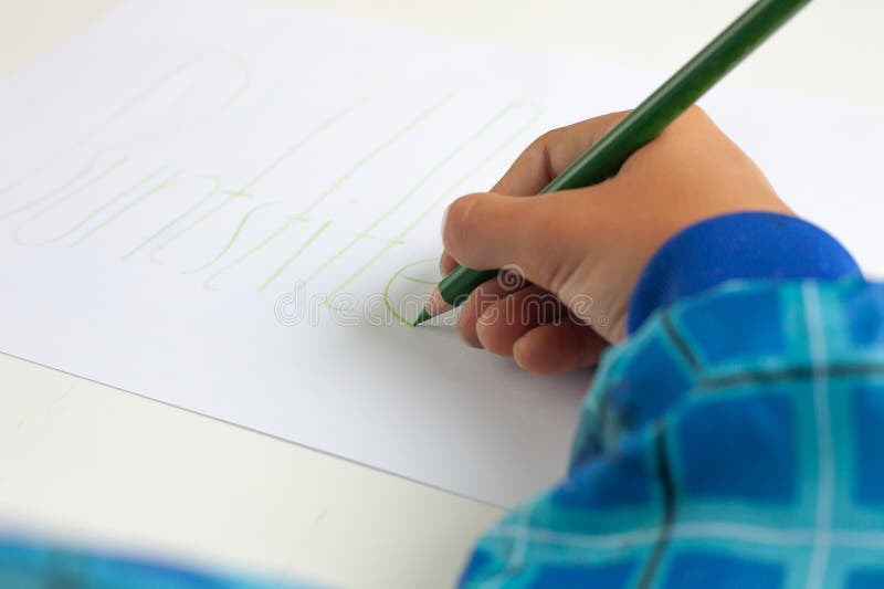 Child Writing on a Sheet of Paper. Stock Image - Image of class ...