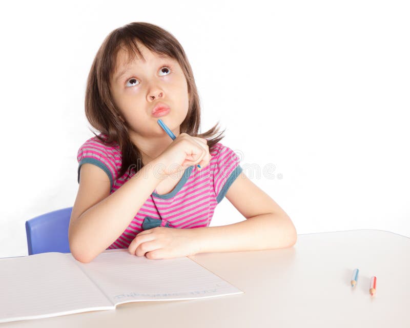 Child Writing And Thinking At Desk Stock Photo - Image of people ...