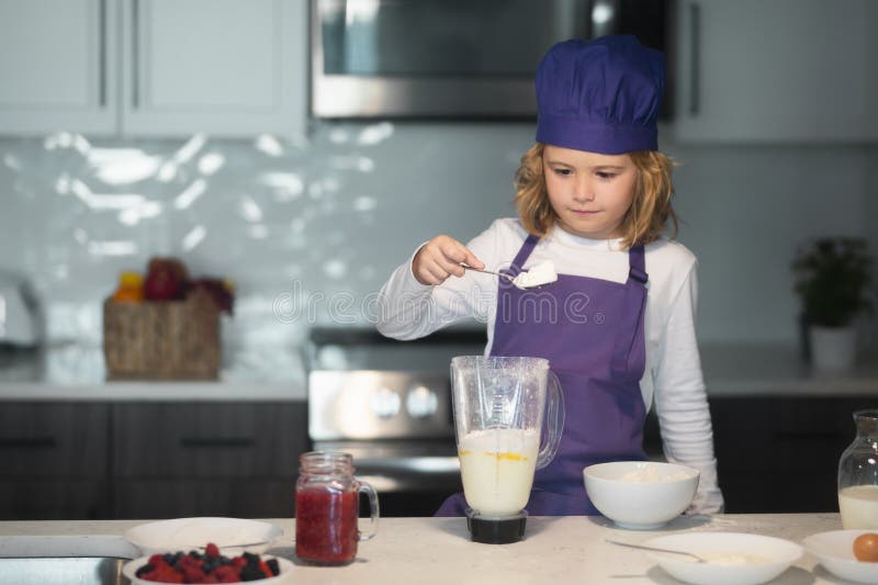 Child 7-8 Years Old in Chef Hat and Apron. Kid Chef Cook is Learning ...