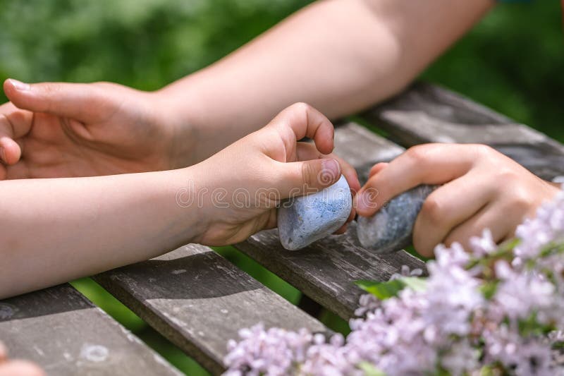 Childhood: Kids Playing Table Game with Stones. Stock Image - Image of ...
