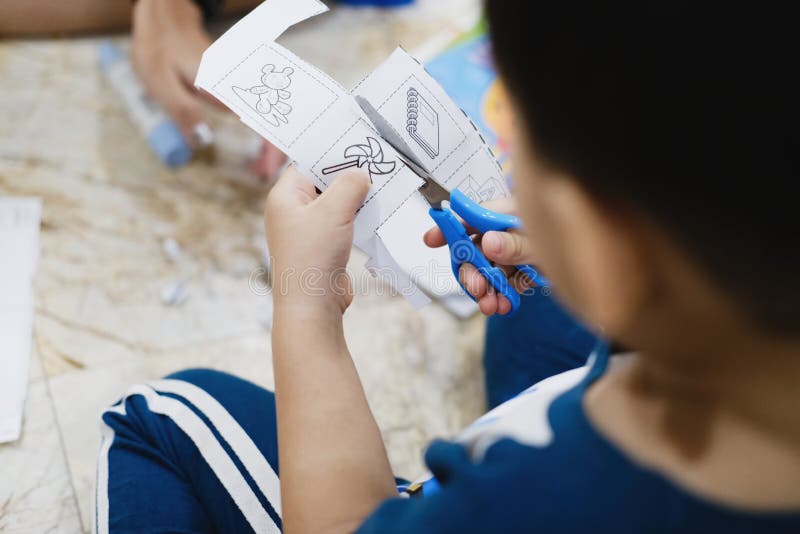 Childhood are Learning To Use Scissors To Cut Paper. Stock Image ...