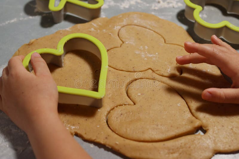 Childmakes Gingerbread from Dough in Cookies Forms on the Table Stock ...