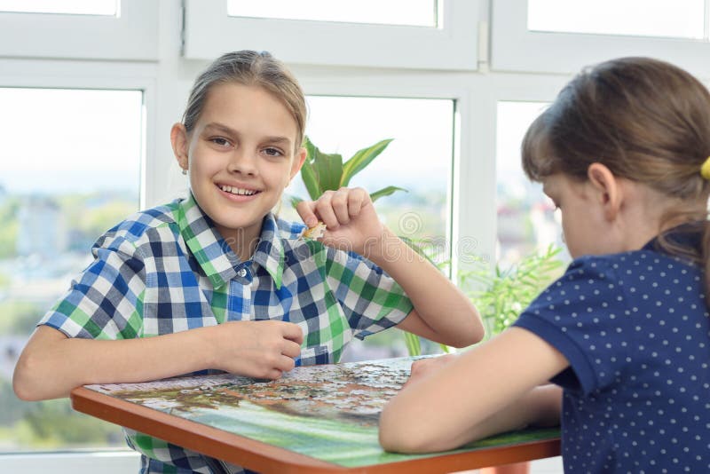 Children Assemble a Puzzle from Puzzles, One of Them Looked into the ...