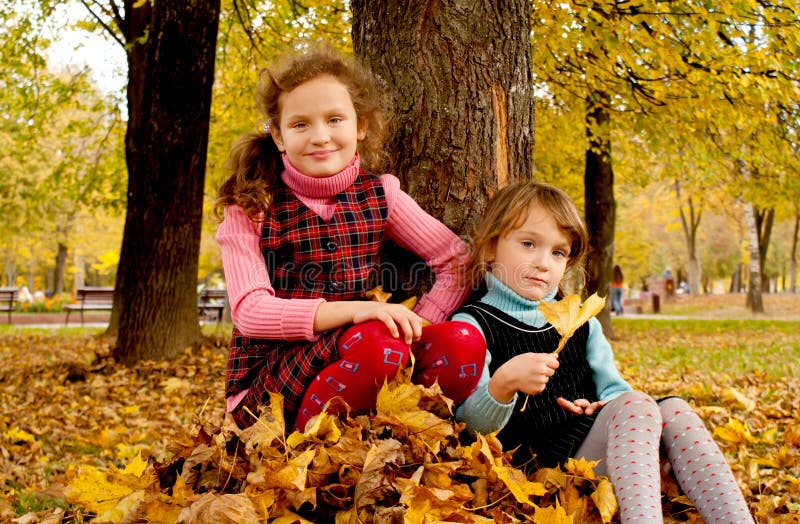 Children in the autumn stock image. Image of cute, nature - 16566381