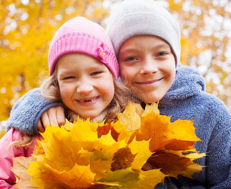 Children in the Autumn Park Walk and Have Fun Stock Photo - Image of ...