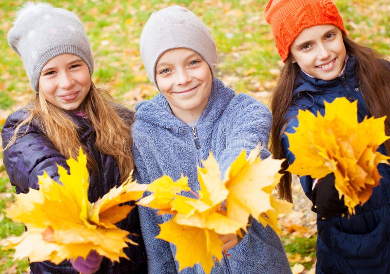 Children at autumn stock image. Image of nature, orange - 43366399