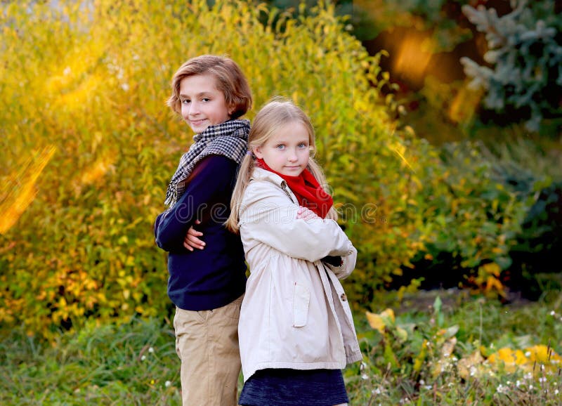 Children in the Autumn Park Walk and Have Fun Stock Photo - Image of ...