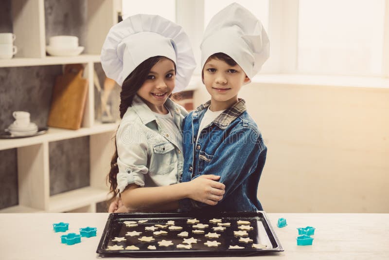 Children baking in kitchen stock image. Image of home - 90304815