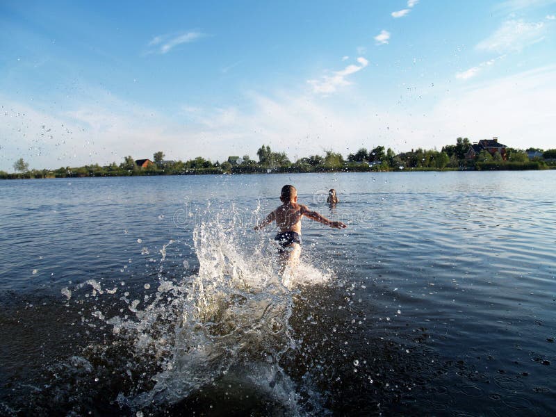 Children Bathe in the River Stock Photo - Image of warm, lake: 128474518