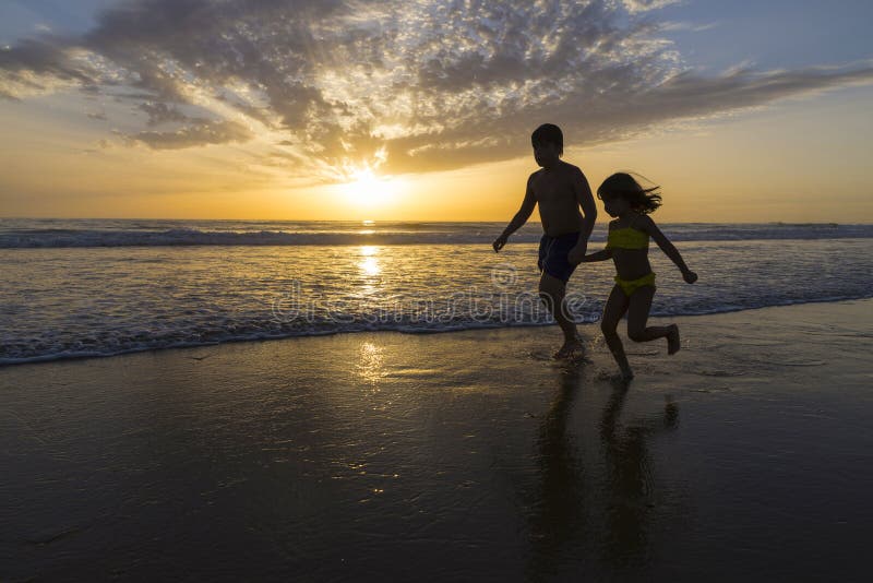 Children Bathing on the Beach at Dusk Stock Image - Image of locations ...