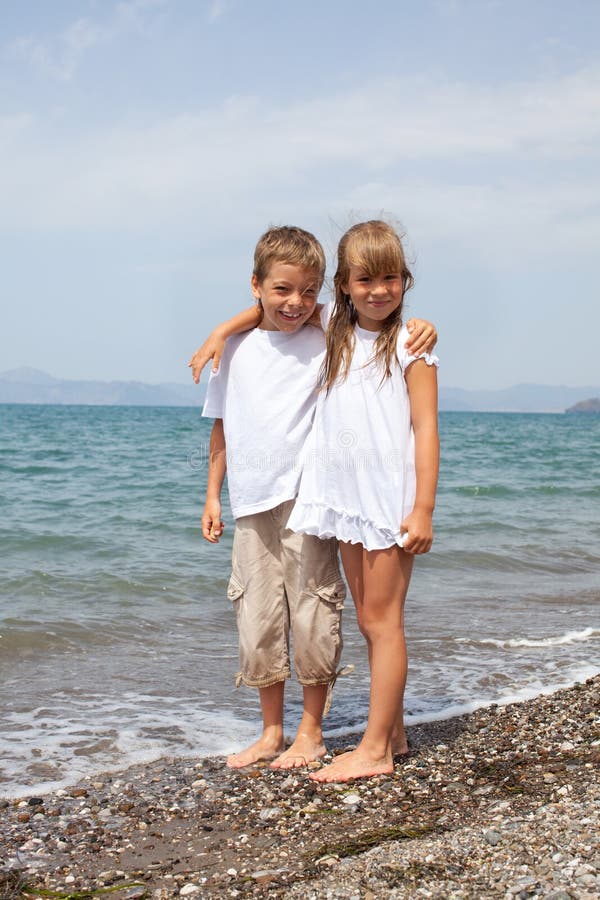 Children on the beach stock photo. Image of cheerful - 19575098