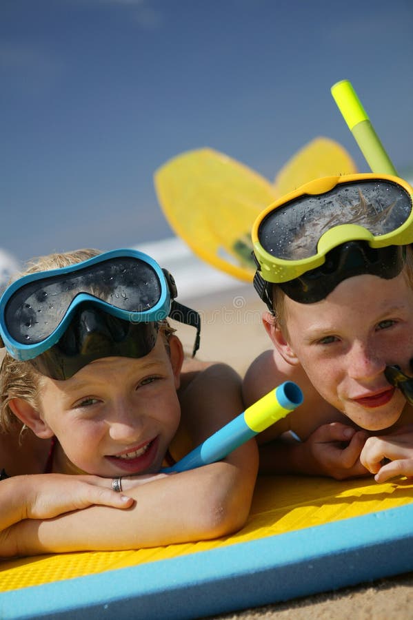 Children at the beach stock photo. Image of beach, lying - 9001068