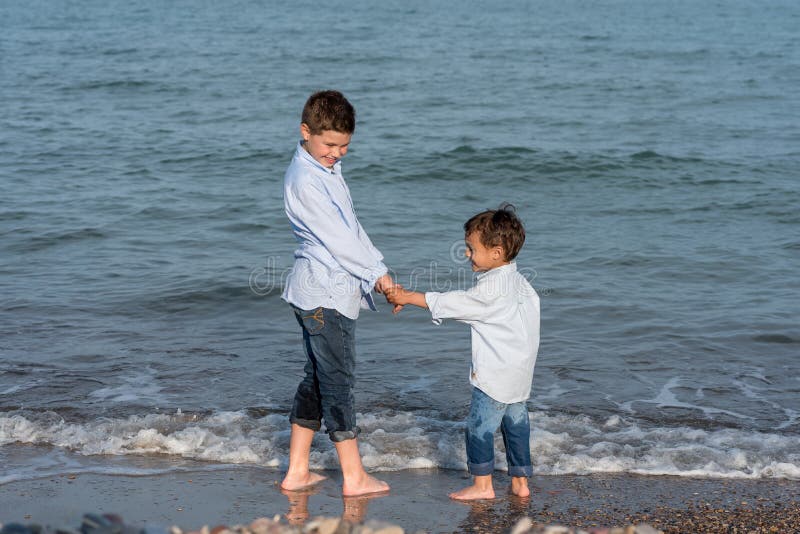 Children on the Beach stock image. Image of child, sail - 53119663