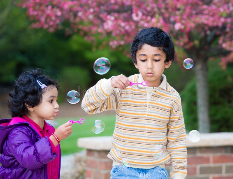 Children Blowing Bubbles in Their Yard Stock Image - Image of girl ...