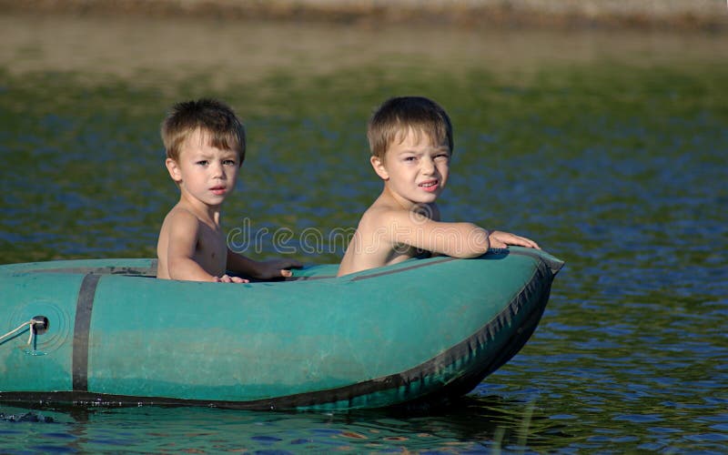 Children in a boat stock photo. Image of lake, child - 12740412