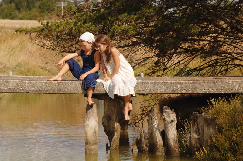 Children on bridge stock photo. Image of children, water - 769256