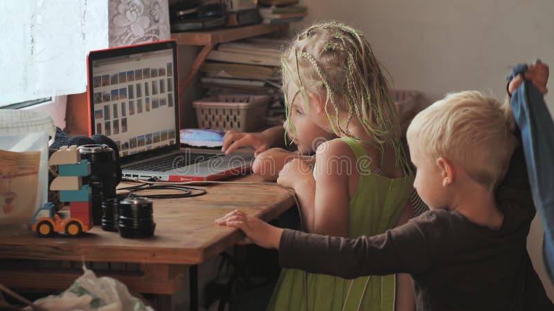Children are Browsing Photos on a Laptop. Stock Footage - Video of ...