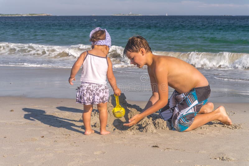 Children Building a Sand Castle Stock Image - Image of shore, beach ...