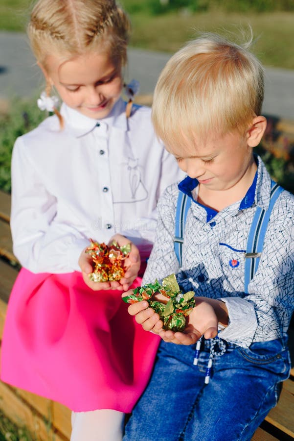 Children with Candy in Their Hands Stock Image - Image of person, face ...
