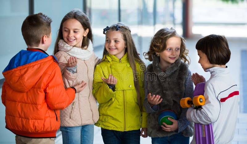 Children chatting outdoors stock image. Image of chatting - 81742425