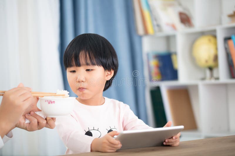 Children in Class on Tablet while Eating Stock Image - Image of ...