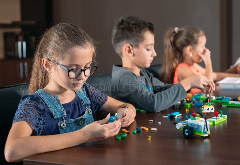 Children in the Classroom Collect Figure from the Designer. Stock Photo ...