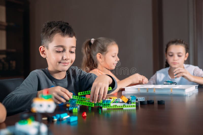 Children in the Classroom Collect Figure from the Designer. Stock Photo ...