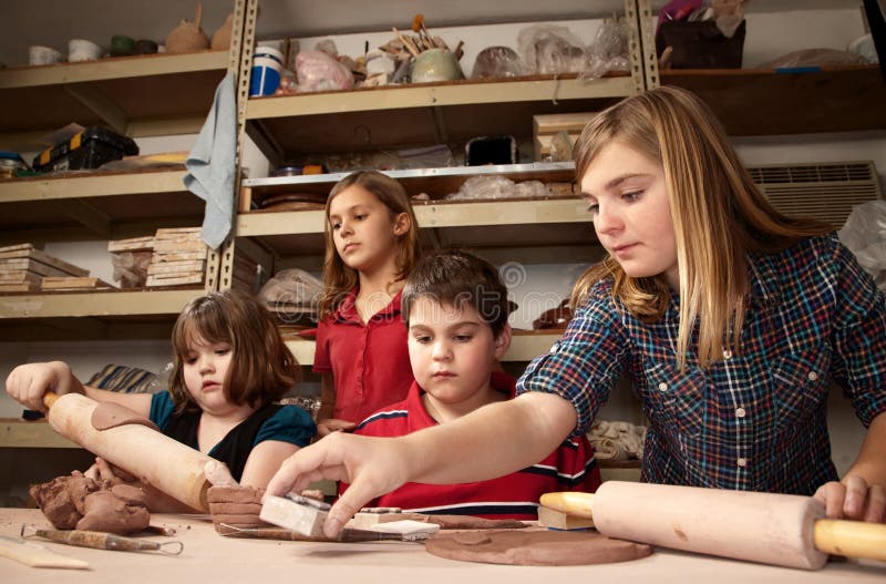 Children in a clay studio stock image. Image of messy - 13348303