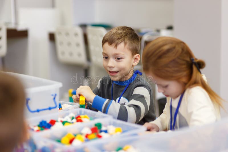 Children Collect Various Objects from Plastic Parts of the Constructor ...