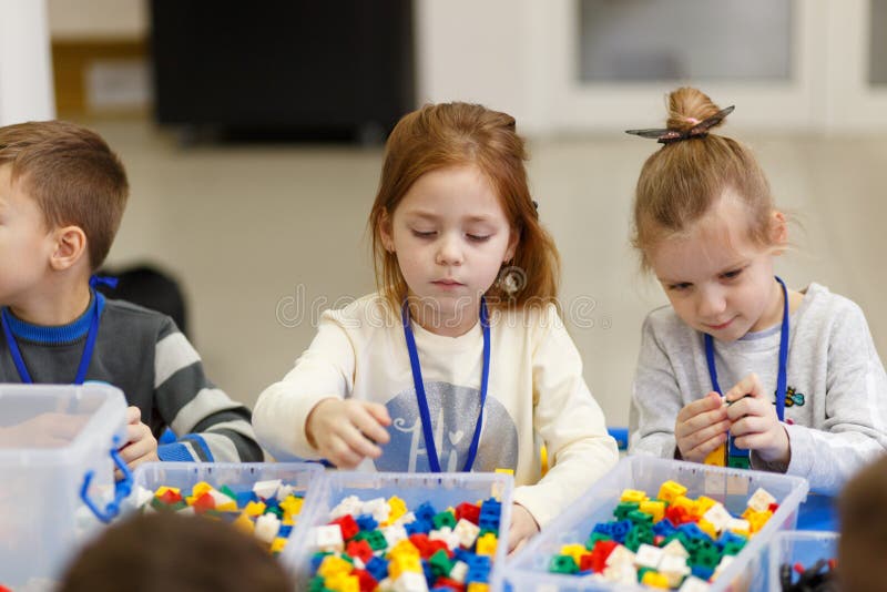 Children Collect Various Objects from Plastic Parts of the Constructor ...