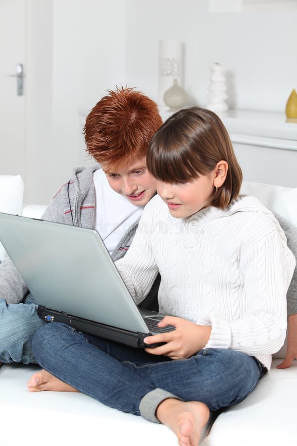 Children and computer stock image. Image of laptop, sofa - 16289535