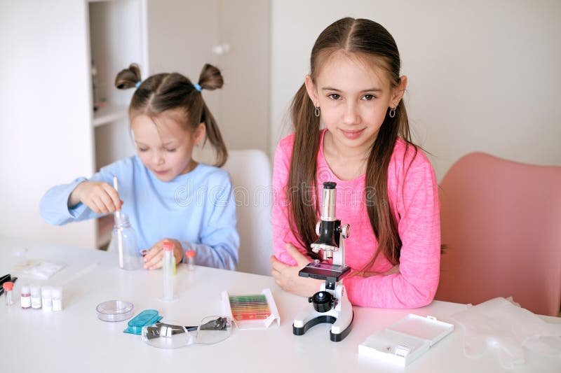 Children Conduct Scientific Experiments and Examine Objects and Their ...