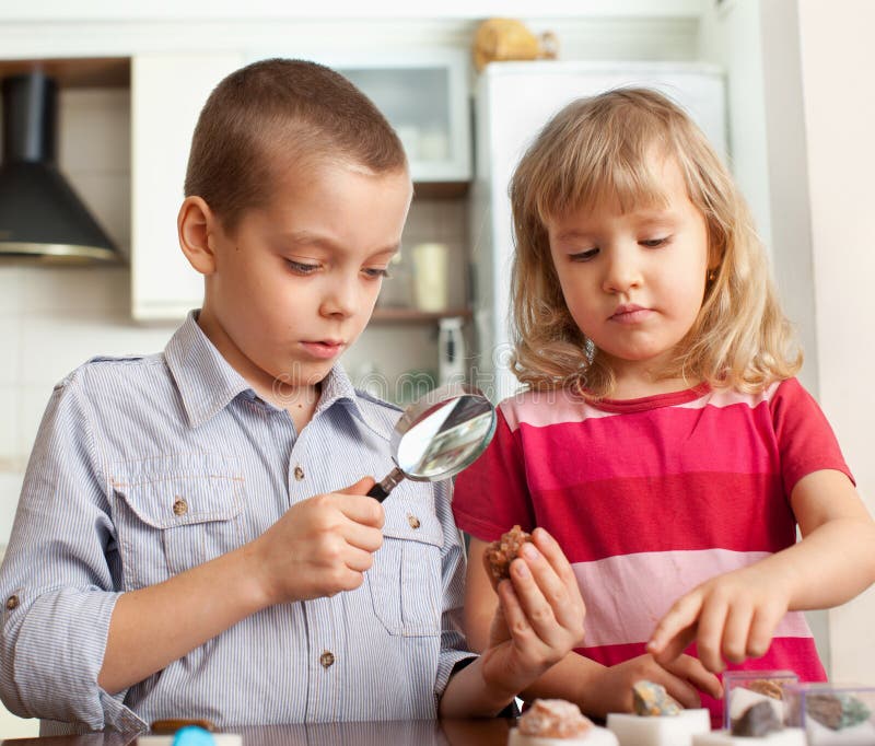 Children are Considering a Collection of Stones Stock Photo - Image of ...