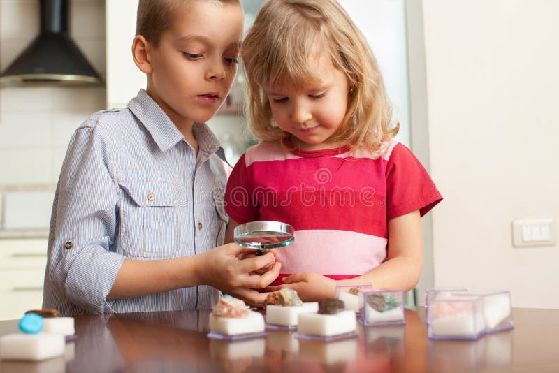 Children are Considering a Magnifying Glass Stones Stock Image - Image ...